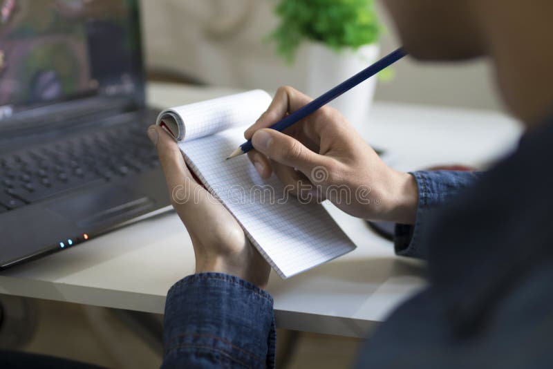 Taking notes in the desk stock photo. Image of casual - 105765100