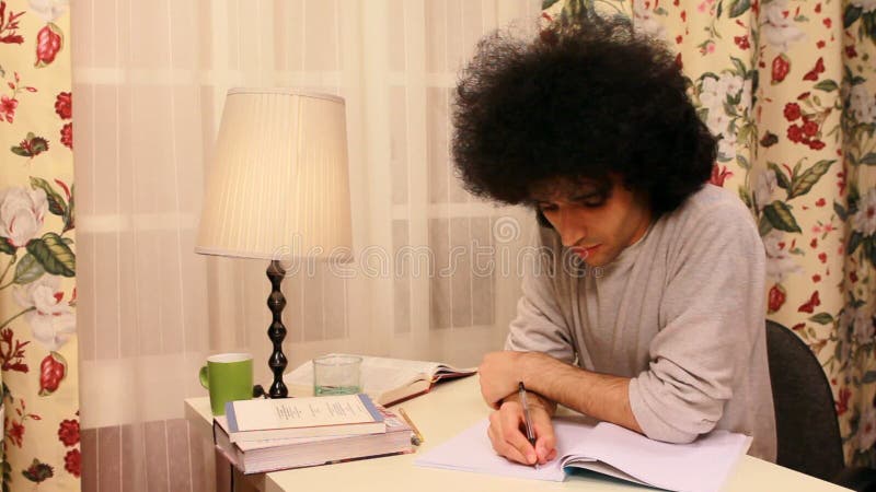 Young Man Studying and Writing on the Book Stock Video - Video of copy ...