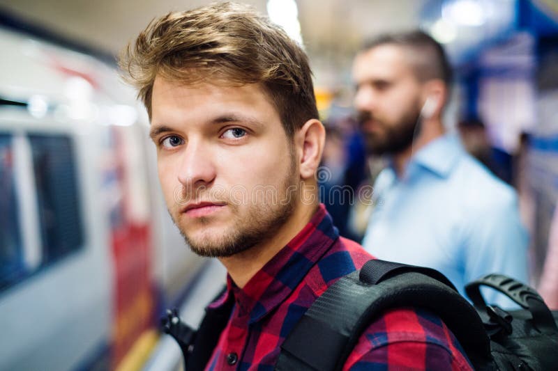 Young man in subway stock image. Image of shirt, england - 64871267