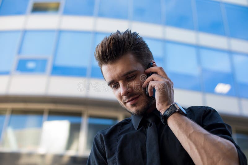 Male Experienced CEO Talking Via Cellphone, Standing Outdoors Against ...