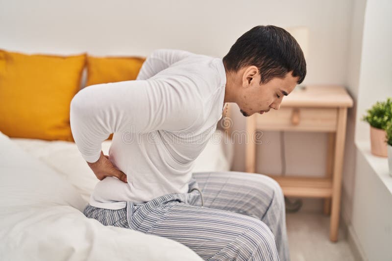 Young Man Suffering for Backache at Bedroom Stock Image - Image of ...