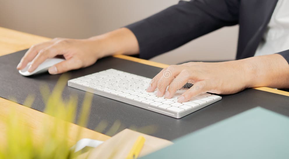 Young Man in Suit Clicking Mouse and Pressing Key of Computer Keyboard ...