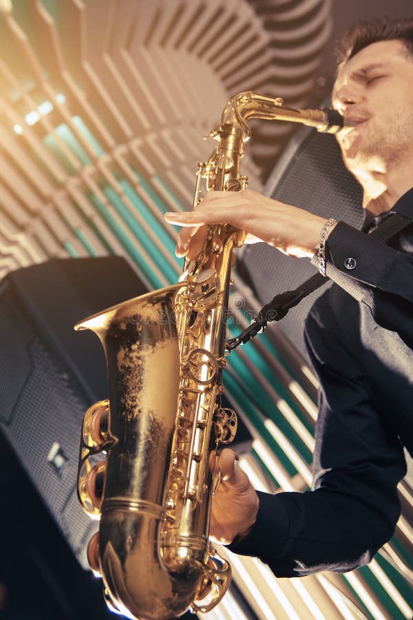 Young Man in a Suit Hold Saxophone Stock Image - Image of casual ...