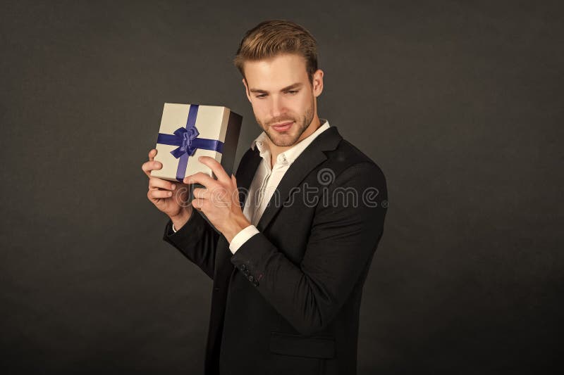 Young Man in Suit Showing Birthday Present Box Stock Photo - Image of ...