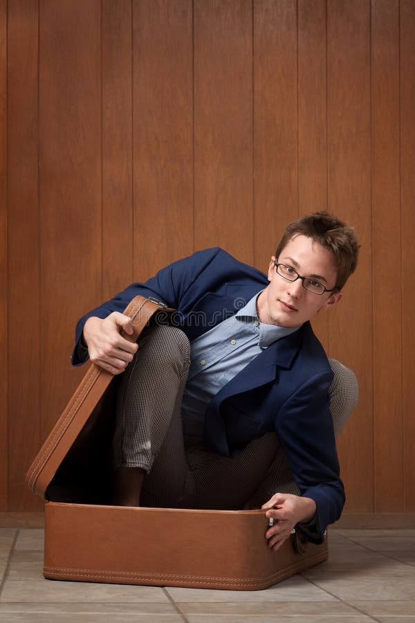 Young Man in Suitcase stock photo. Image of pack, executive - 18858778