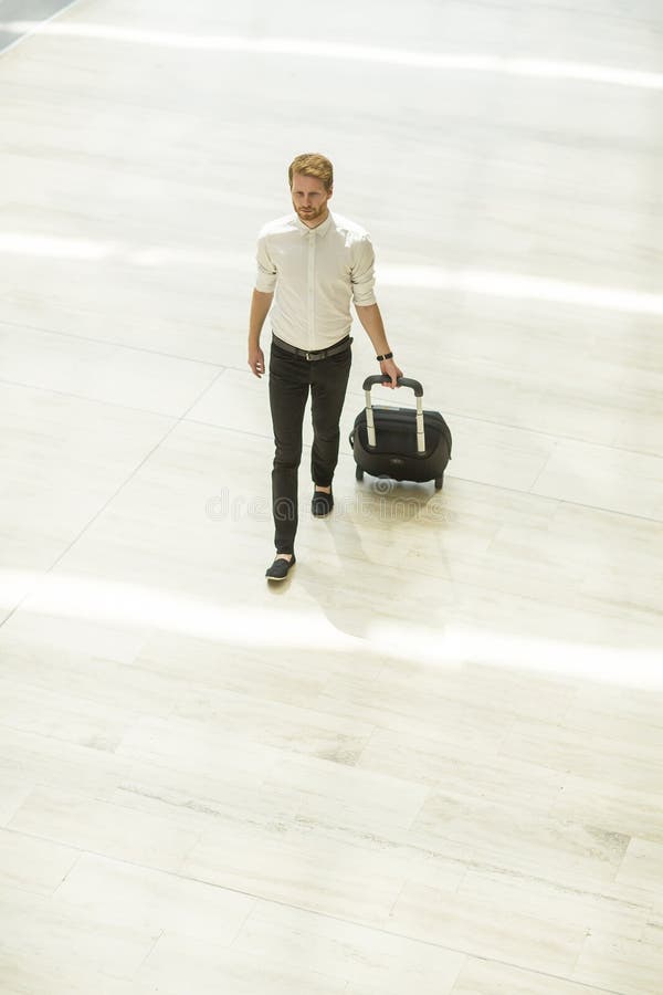 Young man with suitcase stock photo. Image of luggage - 58716154