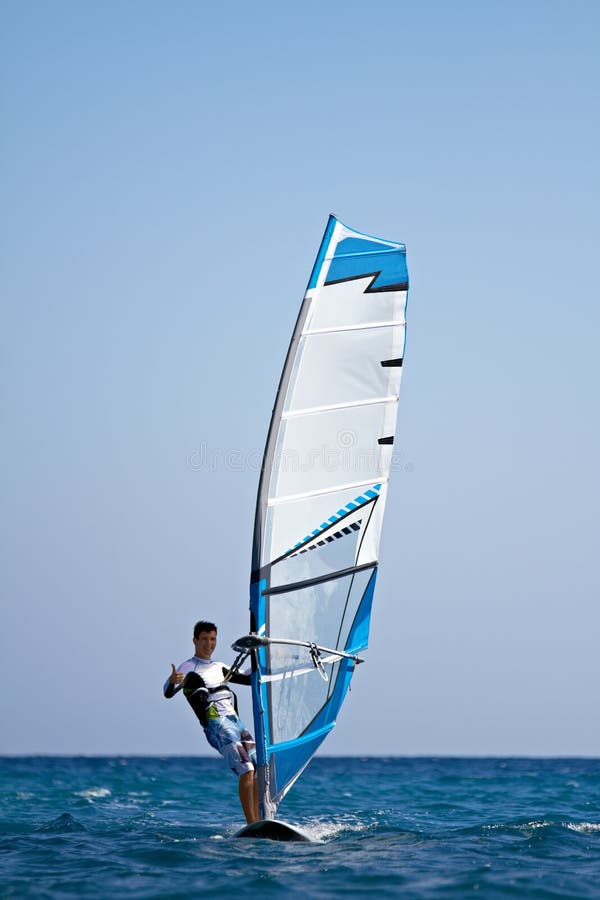 Young man surfing the wind stock image. Image of surfing - 25887369