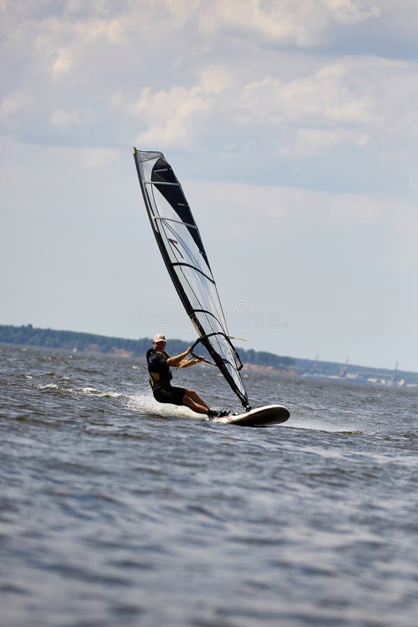 Young Man Surfing the Wind in Splashes of Water Stock Image - Image of ...