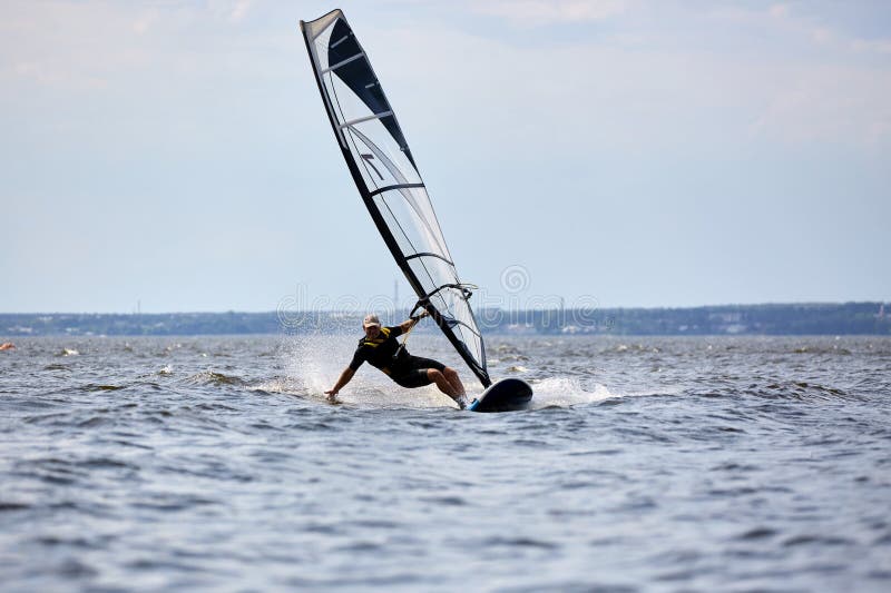 Young Man Surfing the Wind in Splashes of Water Stock Image - Image of ...