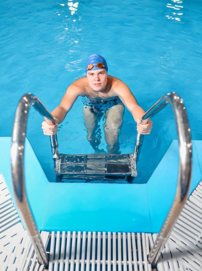 Young Swimmer Woman Getting Out of a Swimming Pool. Stock Image - Image ...