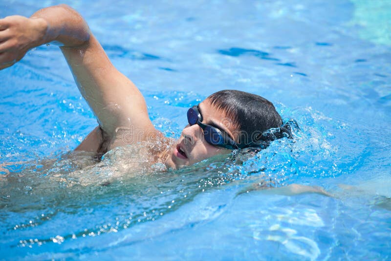 Young Man Swimming Crawl in a Pool Stock Image - Image of health, hobby ...