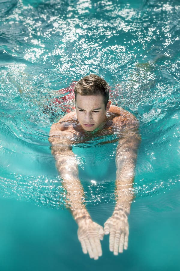 Young man swimming stock image. Image of action, adult - 33975355