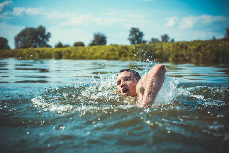 The Young Man Swimming in the River Stock Image - Image of lake ...