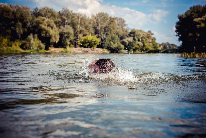 The Young Man Swimming in the River Stock Image - Image of competition ...