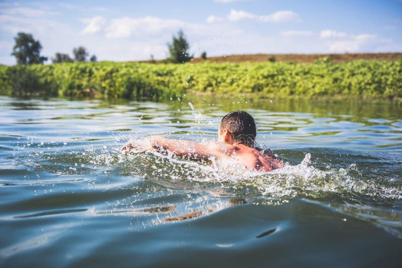 The Young Man Swimming in the River Stock Photo - Image of person ...