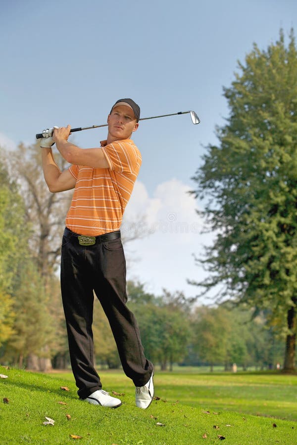 Man Swinging Golf Club stock photo. Image of look, person - 7041376