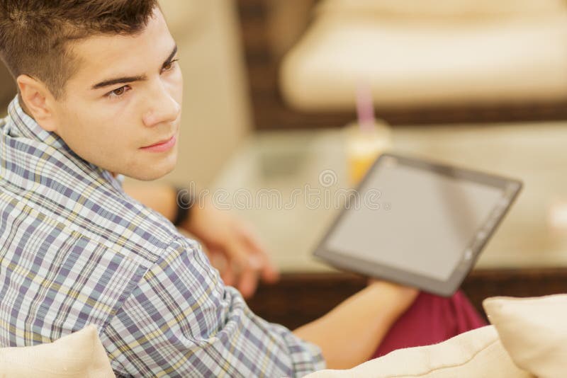 Young man with tablet stock image. Image of closeup, laptop - 32987031