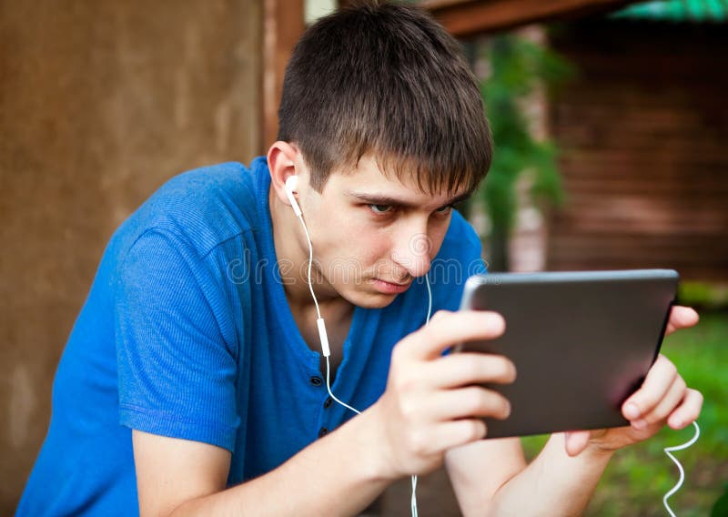 Young Man with a Tablet stock photo. Image of person - 113288926