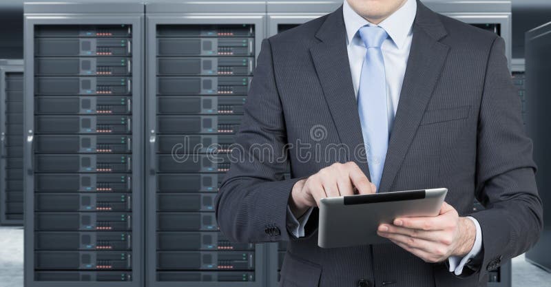 Young Man with a Tablet in Front of Server for Data Storage Stock ...