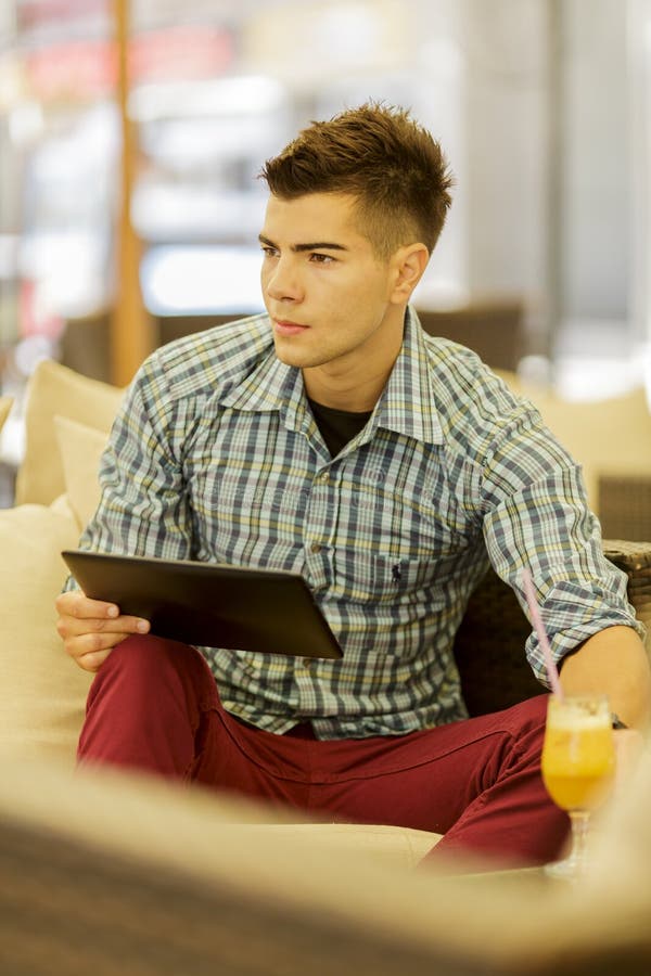 Young man with tablet stock image. Image of portable - 33577589