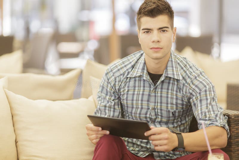 Young man with tablet stock image. Image of computer - 34813453