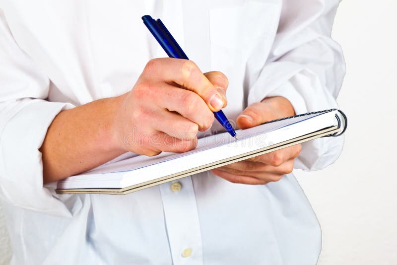 Young man takes notes stock image. Image of hand, document - 37154147