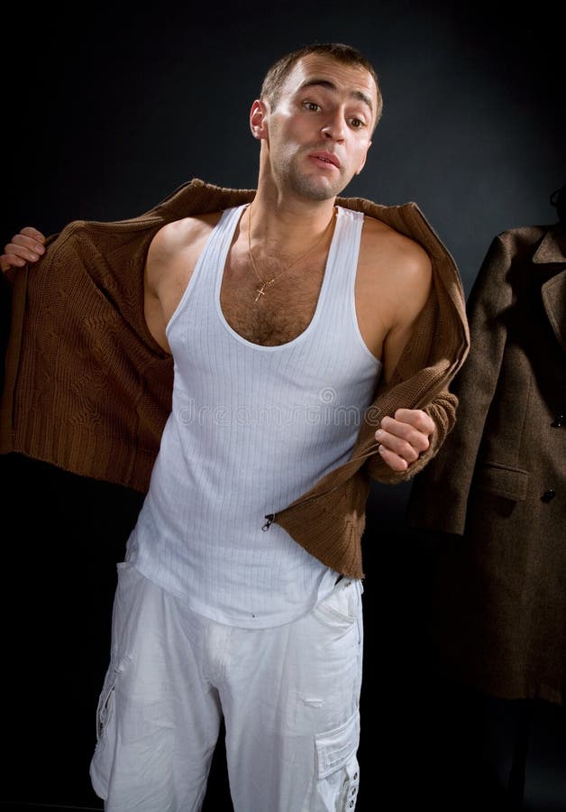 A Young Man Takes Off Fleece Jackets Stock Image - Image of handsome ...