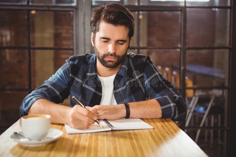 Young Man Taking Notes in His Notebook Stock Image - Image of leisure ...