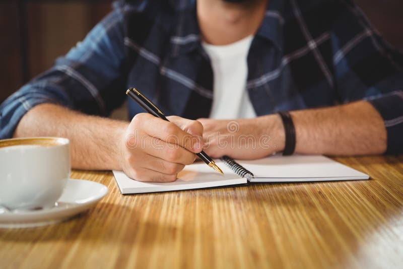 Young Man Taking Notes in His Notebook Stock Image - Image of relaxing ...