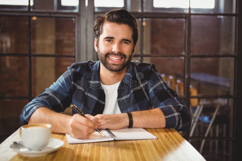 Young Man Taking Notes in His Notebook Stock Photo - Image of time ...