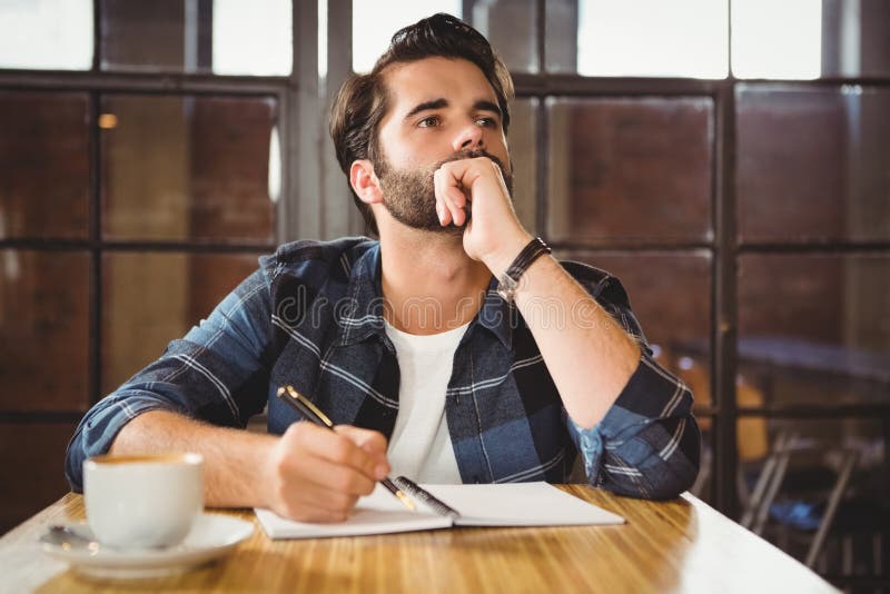 Young Man Taking Notes in His Notebook Stock Image - Image of male ...