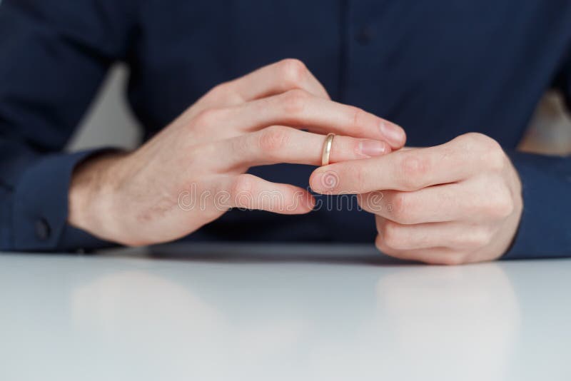 Young Man is Taking Off the Wedding Ring. Close Up View Stock Image ...