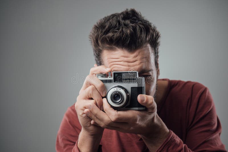 Young Man Taking Pictures with a Vintage Camera Stock Image - Image of ...