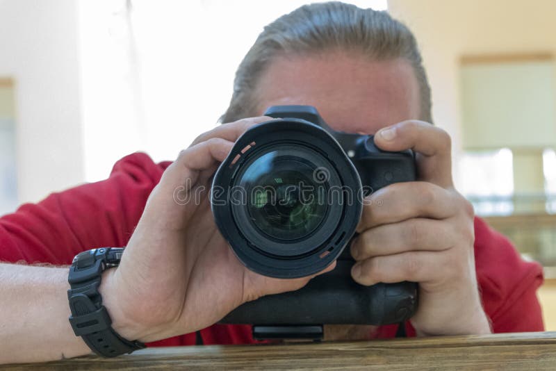Young Man is Taking a Selfie Photo through the Mirror with Focus on ...