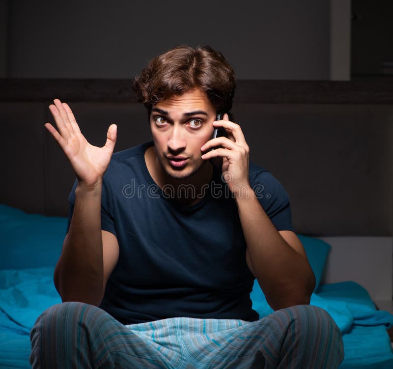Young Man Talking on Mobile Late at Night Stock Photo - Image of ...