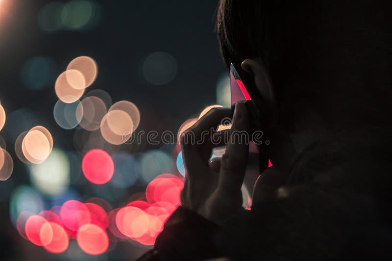 Young Man Talking on Mobile Phone at Night Stock Image - Image of ...