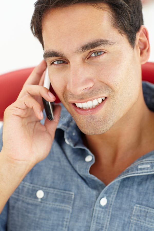 Young Man Talking on the Phone Stock Image - Image of indoors, dress ...