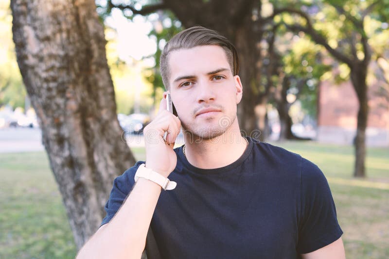 Young Man Talking on the Phone. Outdoors. Stock Photo - Image of ...
