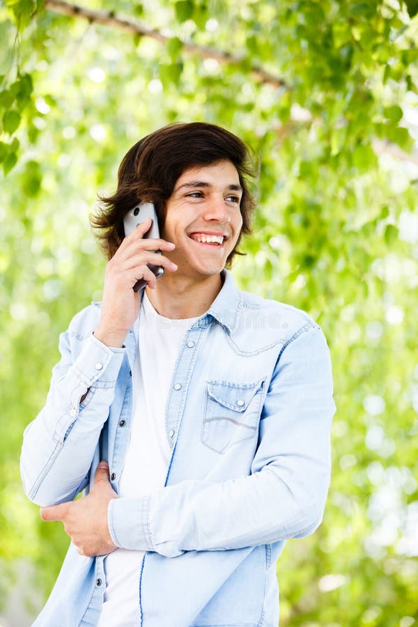 Young Man Talking on Phone while Standing Outdoor Stock Photo - Image ...
