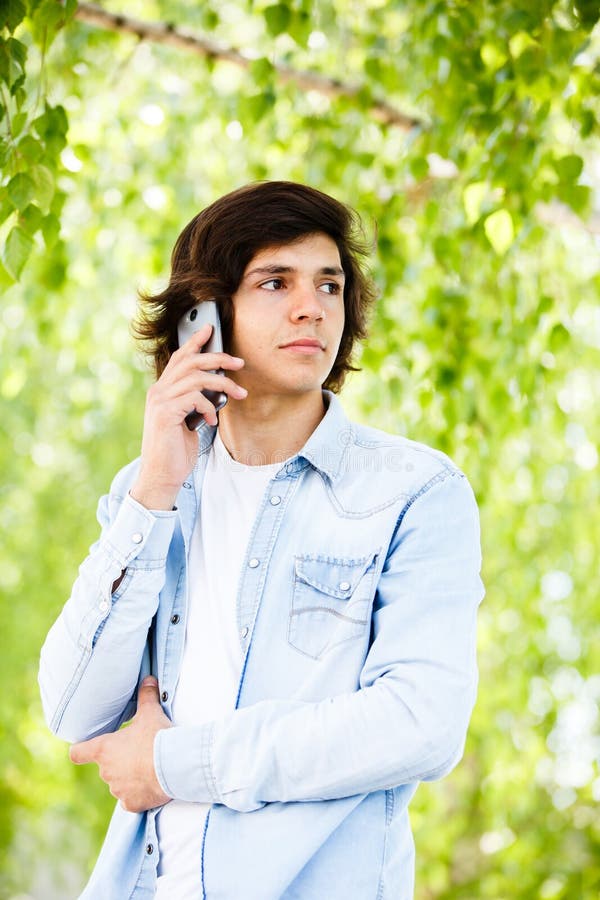 Young Man Talking on Phone while Standing Outdoor Stock Image - Image ...