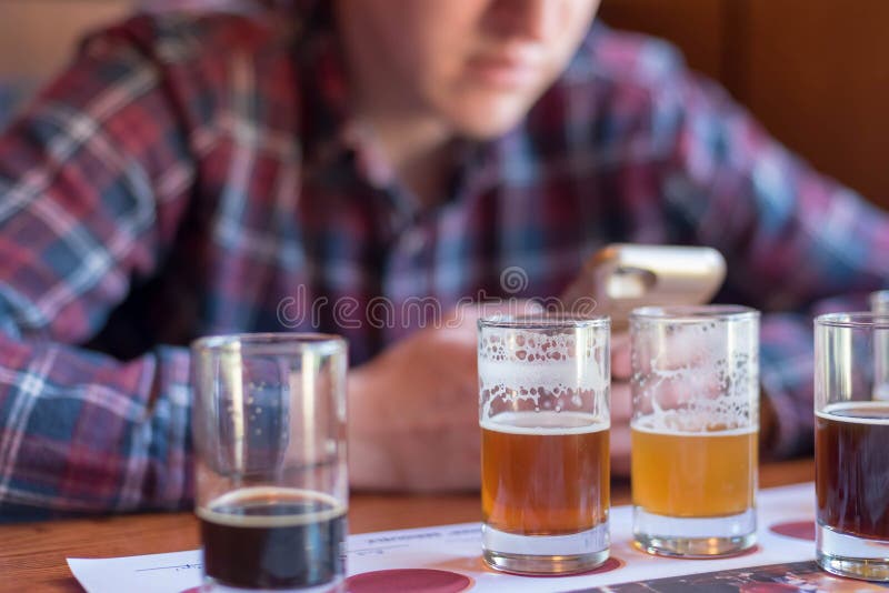 Young Man Checking in Beers on App Stock Image - Image of drink, hops ...
