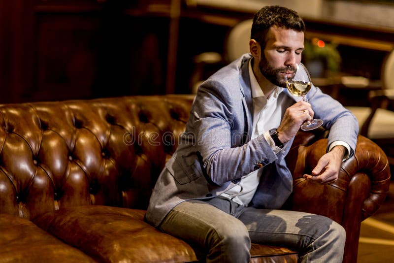 Man Tasting White Wine and Smoking Cigar Stock Image - Image of serious ...