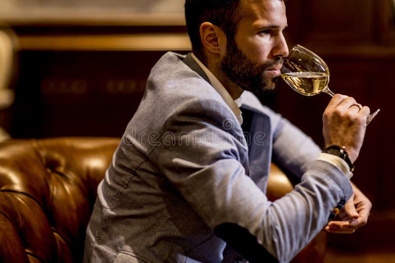Man Tasting White Wine and Smoking Cigar Stock Image - Image of serious ...