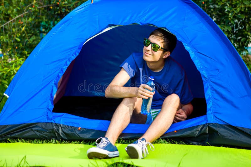 Young Man in the Tent stock image. Image of dome, contemplate - 148499893