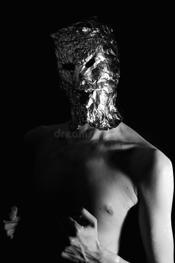 A Young Man in a Terrible Metal Mask Stock Photo - Image of black ...
