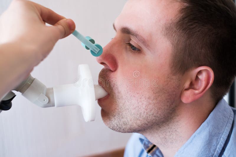 Young Man Testing Breathing Function by Spirometry Stock Image - Image ...