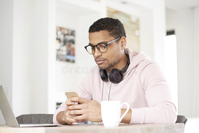 Young man text messaging stock photo. Image of relaxed - 89328598