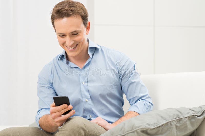 Smiling Man Texting on Mobile Phone Stock Image - Image of good, face ...