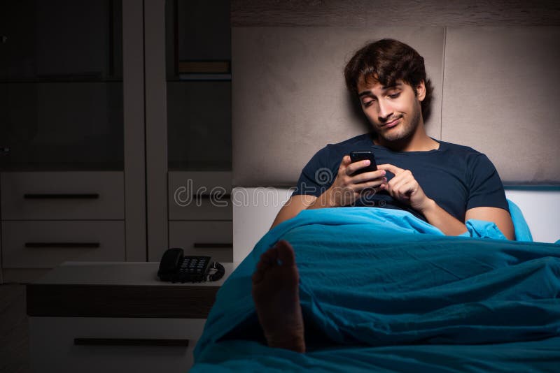 The Young Man Texting on Mobile Late at Night Stock Photo - Image of ...