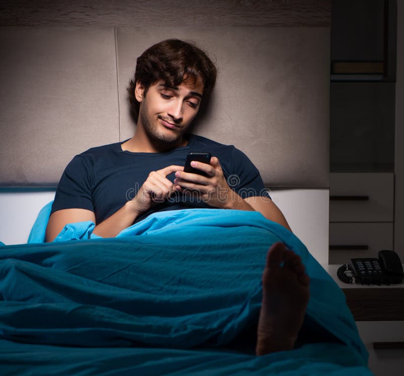 Young Man Texting on Mobile Late at Night Stock Image - Image of asleep ...